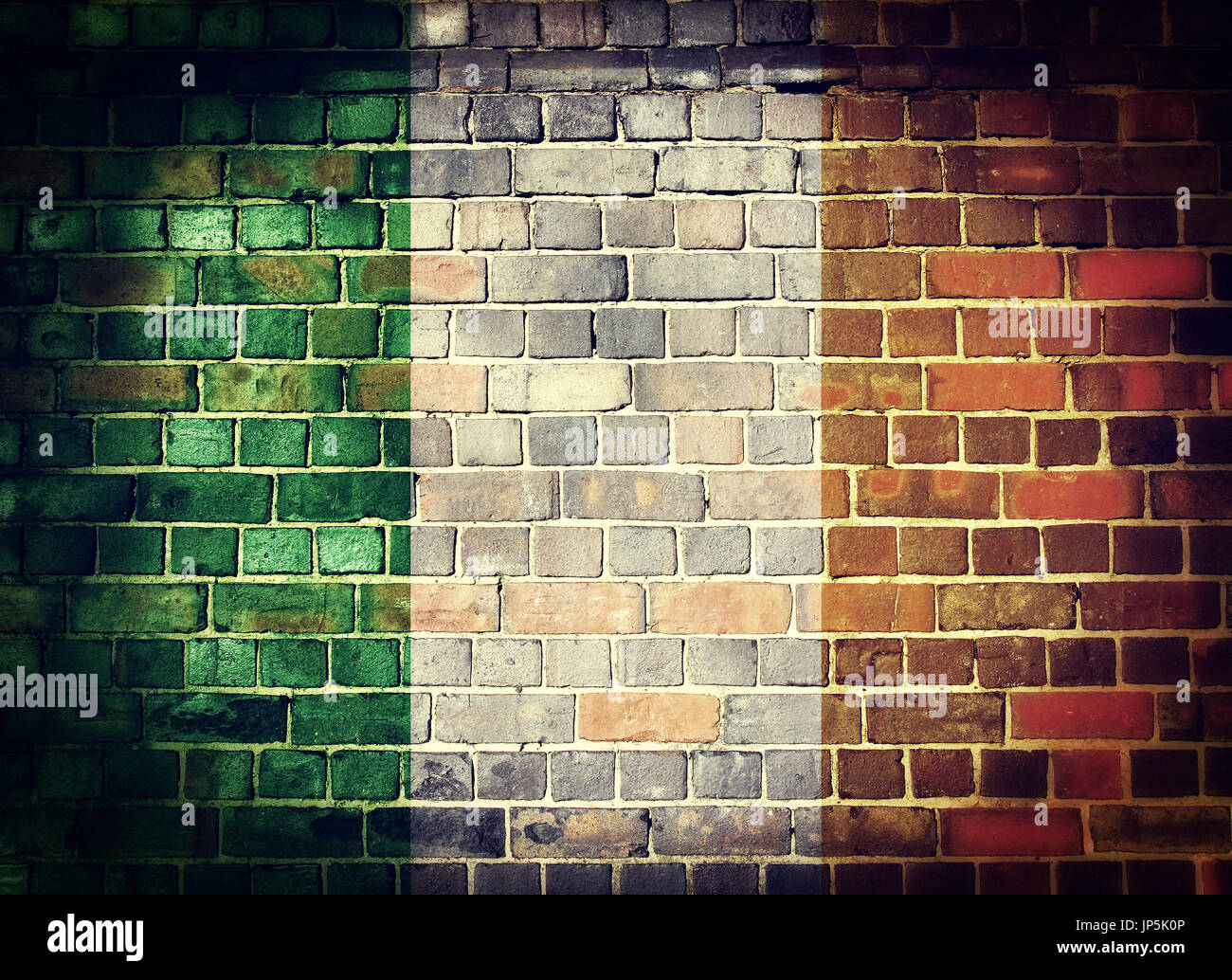 Faded Irish flag on a brick wall background with a dark vignette Stock ...