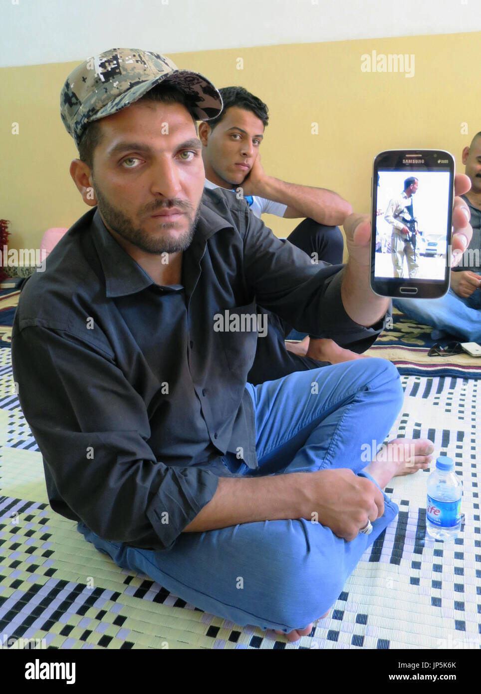 BAGHDAD, Iraq - A man in Sadr City, a Shiite stronghold in Baghdad, on ...