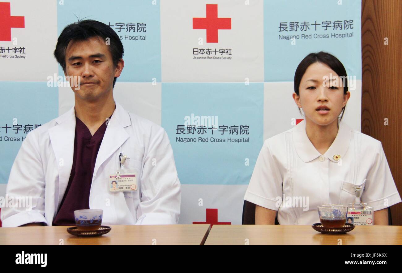 NAGANO, Japan - Nagano Red Cross Hospital doctor Kaneyuki Furihata (L ...