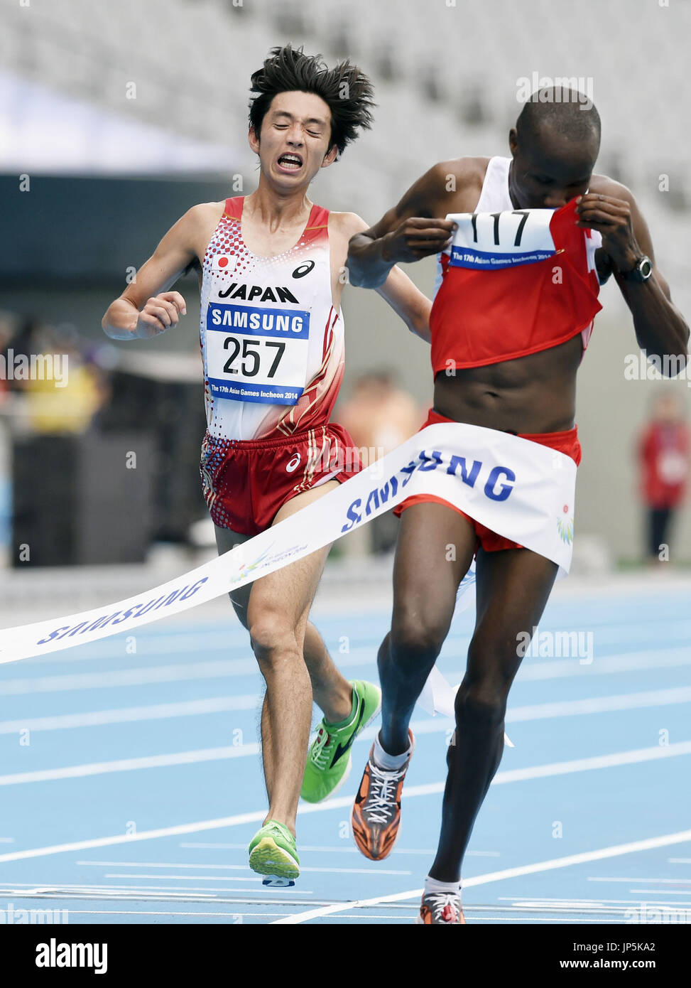 INCHEON, South Korea - Hasan Mahboob (117) of Bahrain and Kohei ...
