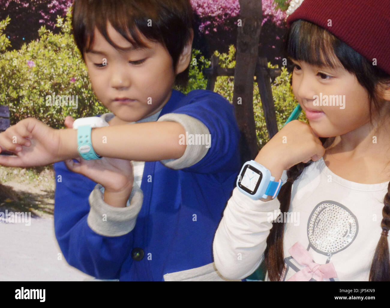 TOKYO, Japan - Children show off the Docotch 01, NTT Docomo Inc.'s ...
