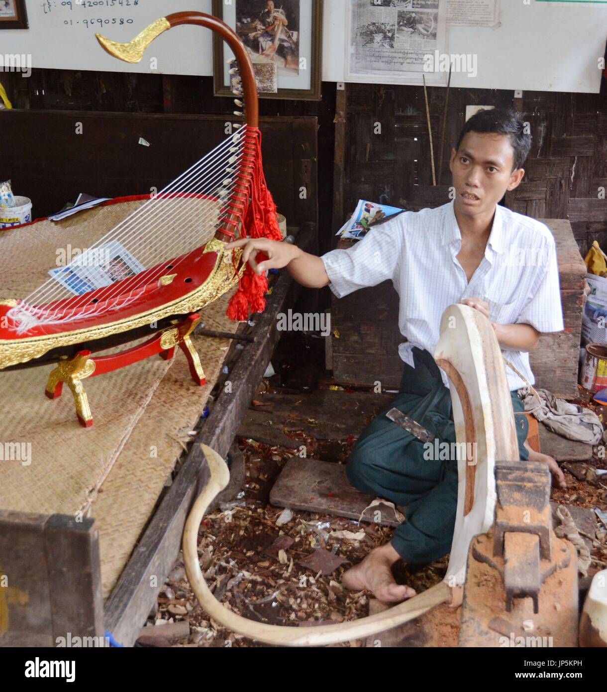 YANGON, Myanmar - A craftsman talks about Saung-gauk, traditional ...