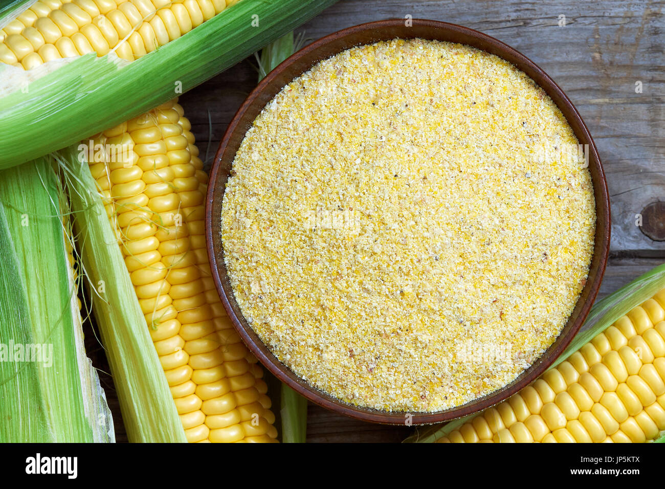 Organic maize flour in wooden bowl with fresh corn. Top view Stock ...