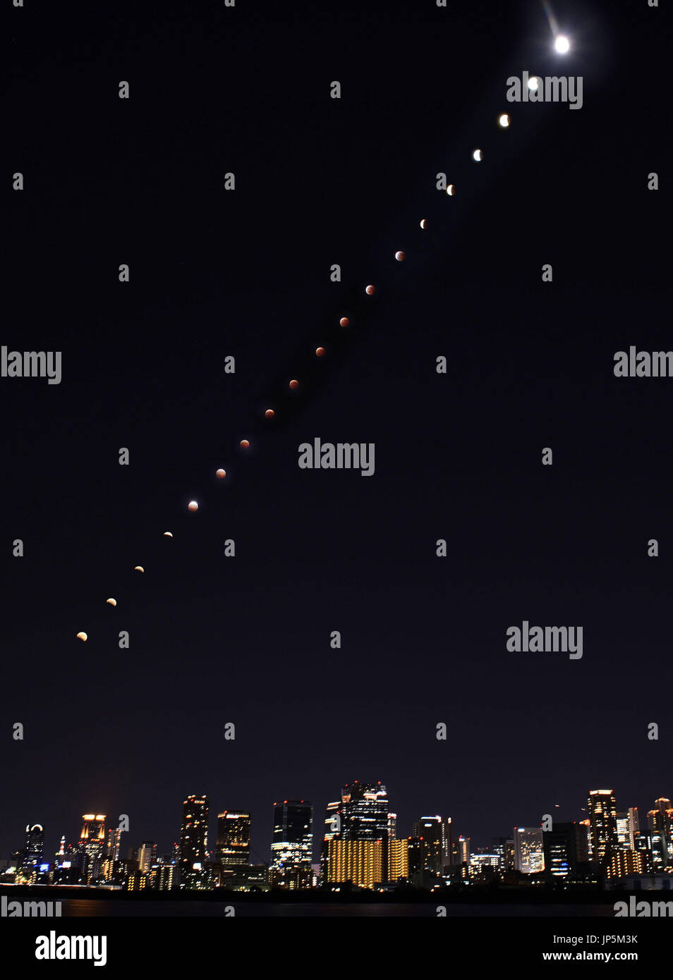 OSAKA, Japan - Successive composite photo shows a total lunar eclipse ...