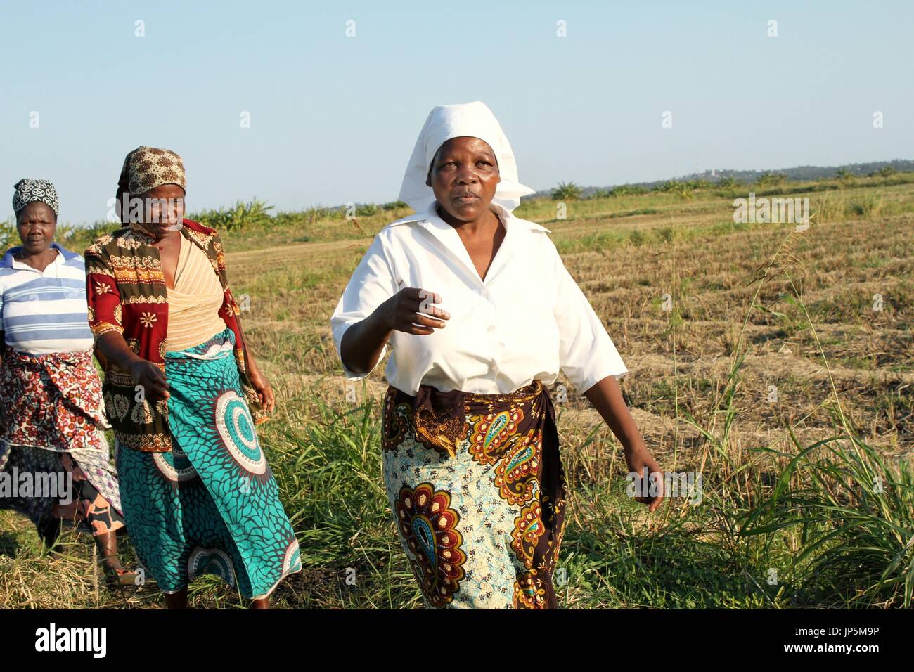 MAPUTO, Mozambique - Women walk by land they used to farm in Xai-Xai ...