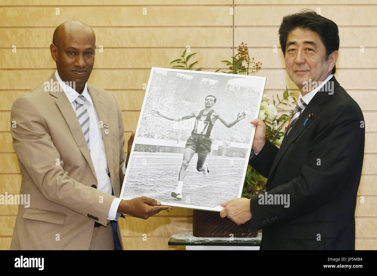 TOKYO, Japan - Yetnayet Abebe (L), son of Ethiopian marathon legend ...