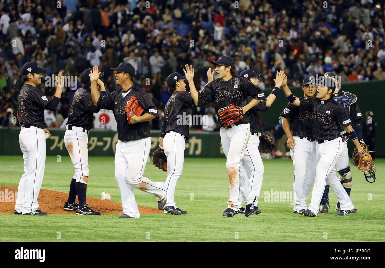 TOKYO, Japan - Members of Samurai Japan celebrate after winning 8-4 in ...