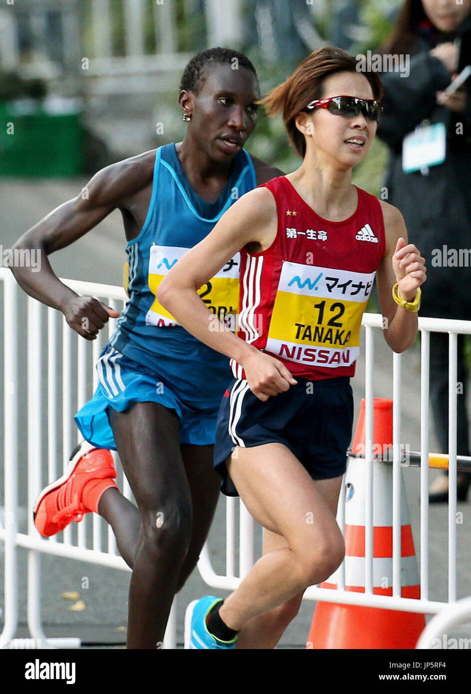 YOKOHAMA, Japan - Japan's Tomomi Tanaka (R) leads Philes Ongori of ...
