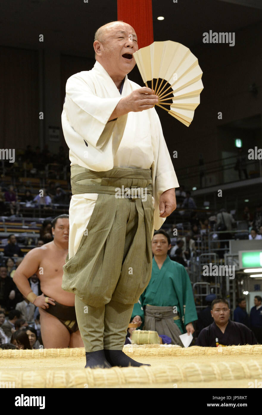 FUKUOKA, Japan - Hideo, the top-ranked "yobidashi" (sumo ring usher ...