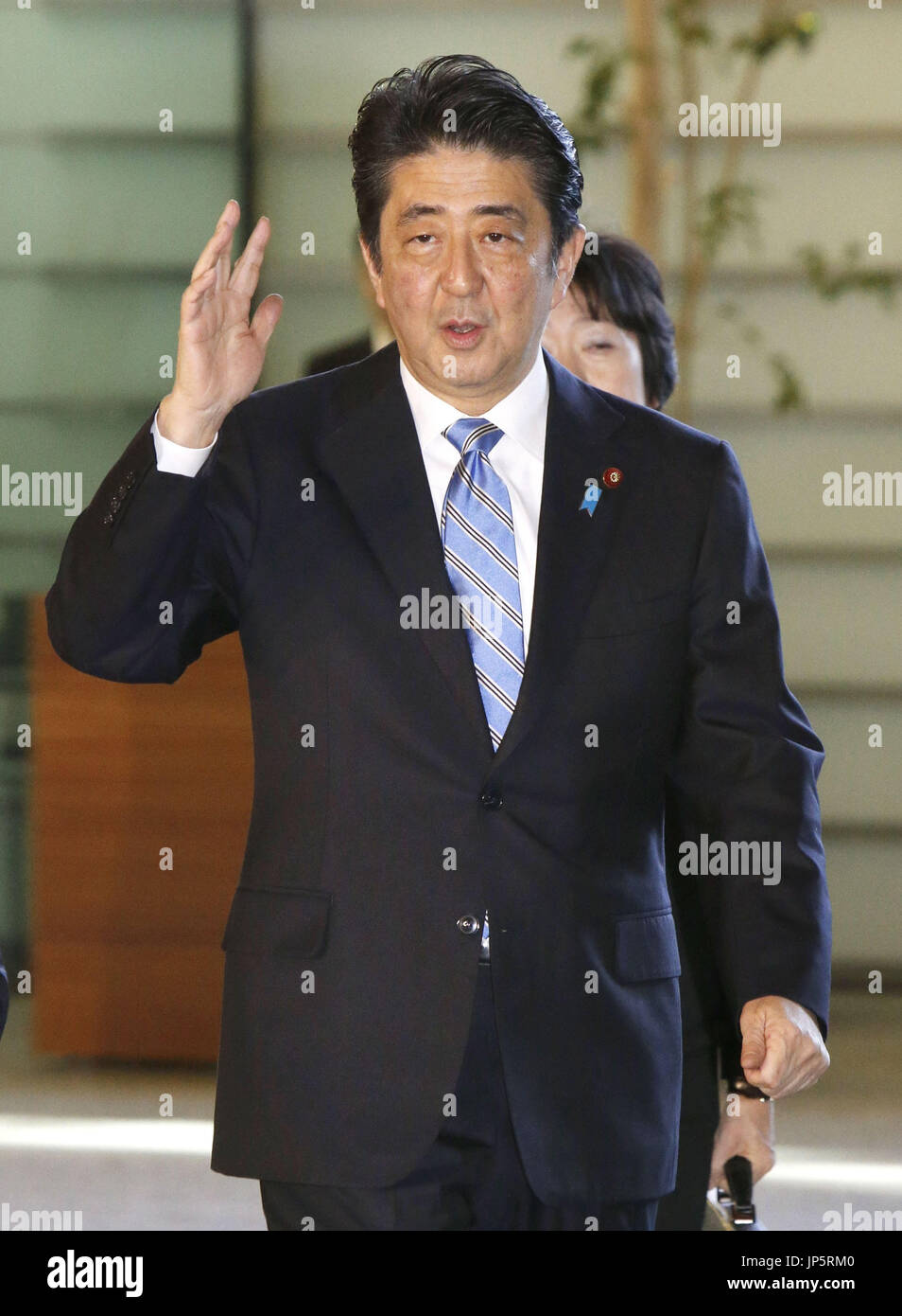 TOKYO, Japan - Japan's Prime Minister Shinzo Abe enters his office in ...