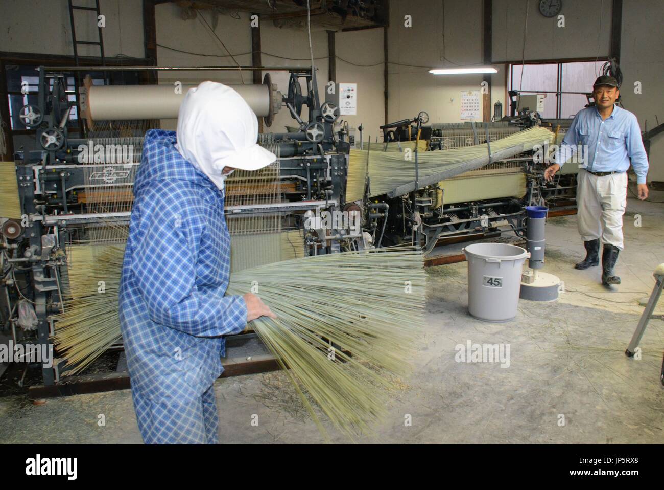 KANAZAWA, Japan - Takashi Miyamoto (R), the only "igusa" rush grower in ...