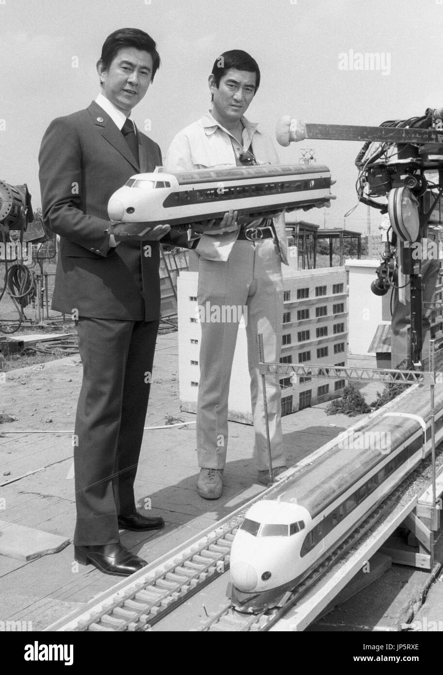 TOKYO, Japan - Renowned Japanese actor Ken Takakura (R) holds a model ...