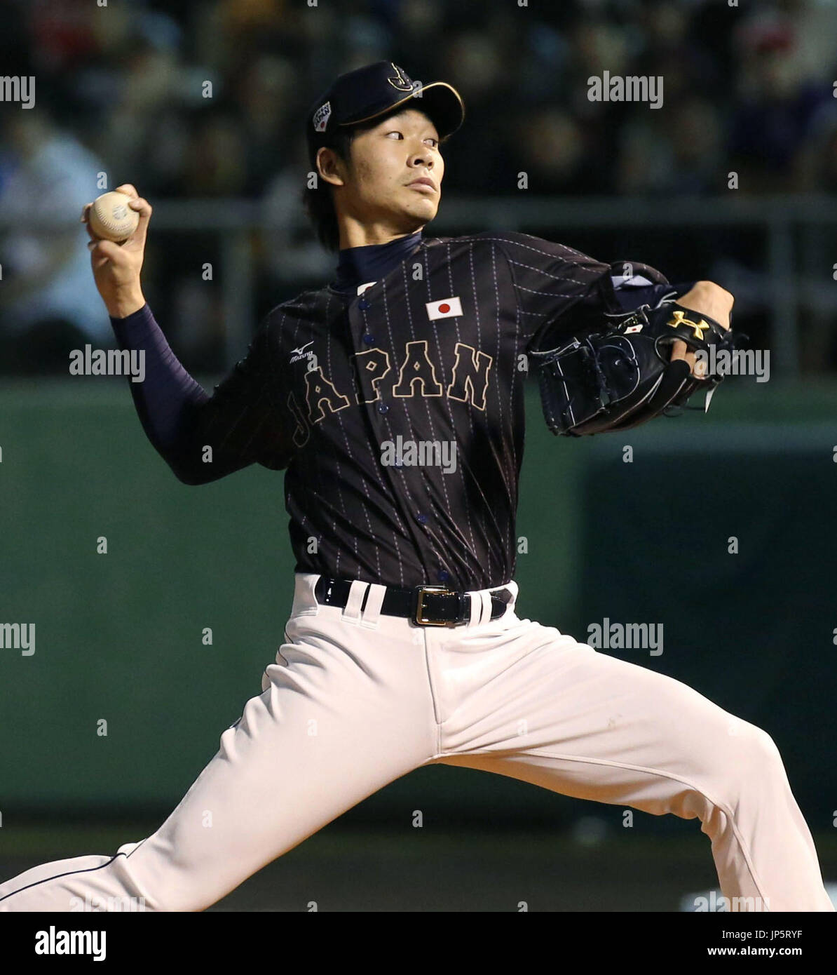 NAHA, Japan - Japan starter Shota Takeda pitches against MLB All-Stars ...