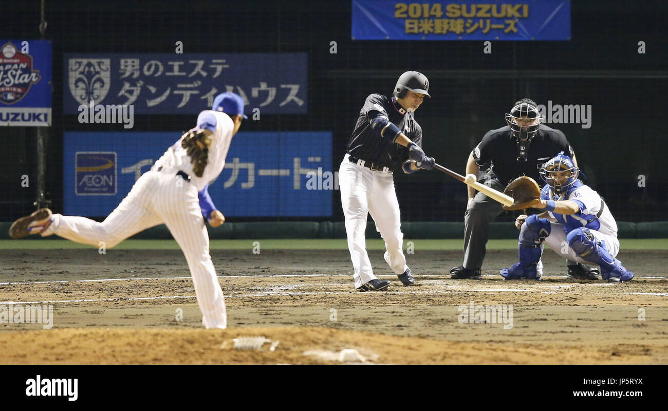 NAHA, Japan - Japan's Yoshihiro Maru hits an RBI triple off MLB All ...