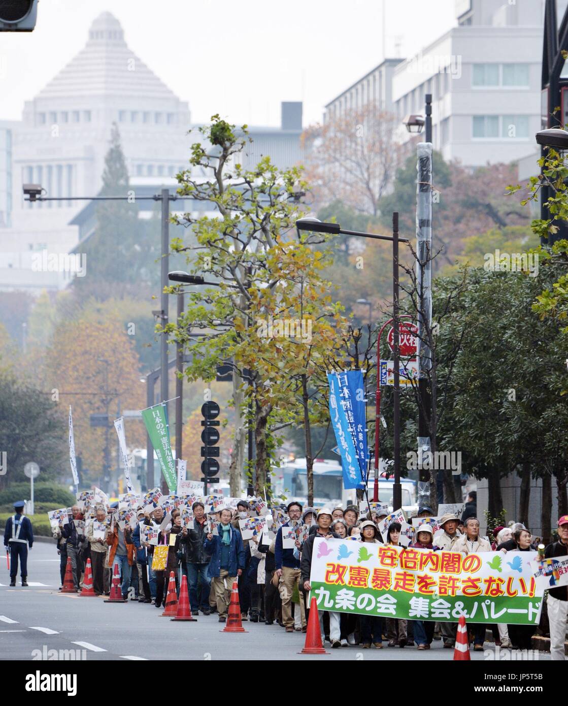 TOKYO, Japan - People march in downtown Tokyo, Japan, on Nov. 24, 2014 ...
