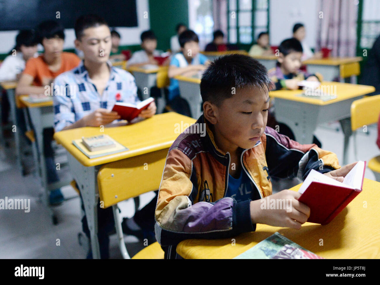 BEIJING, China - Boarding school students read quotations from Chairman ...