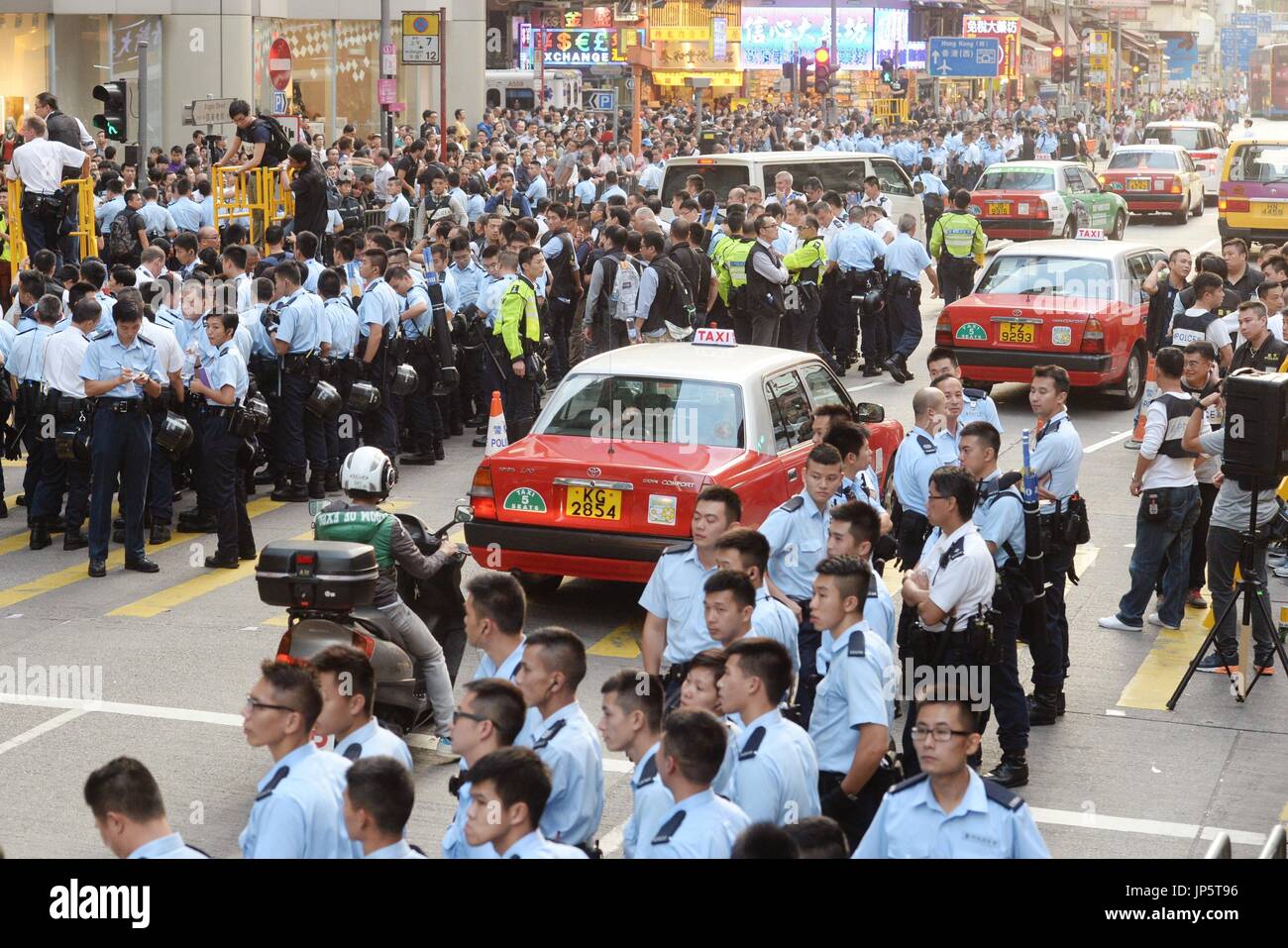 HONG KONG, China - Police officers keep guard on a road in the Mongkok ...