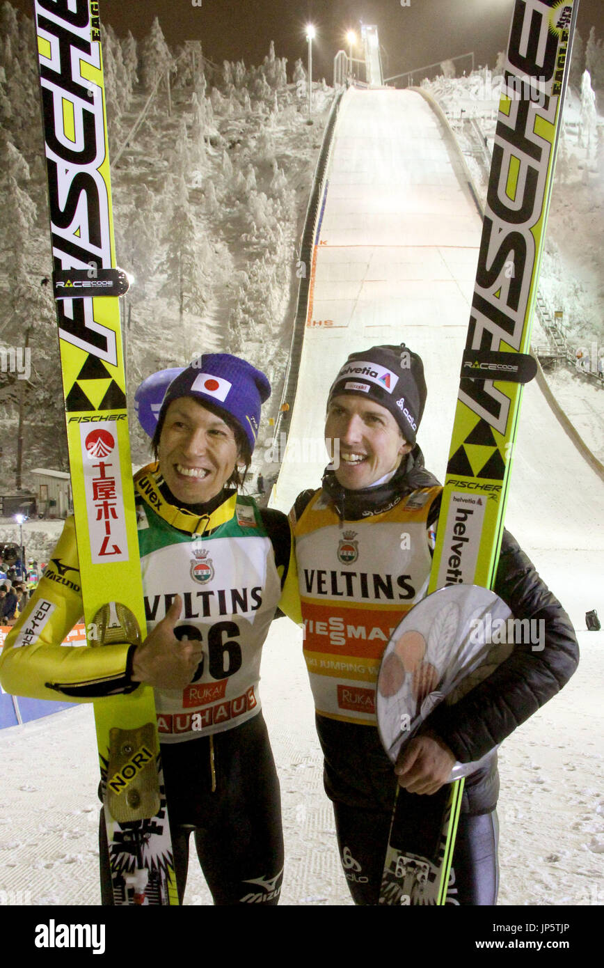 RUKA, Finland - Japan's Noriaki Kasai (L) and Switzerland's Simon Amman ...