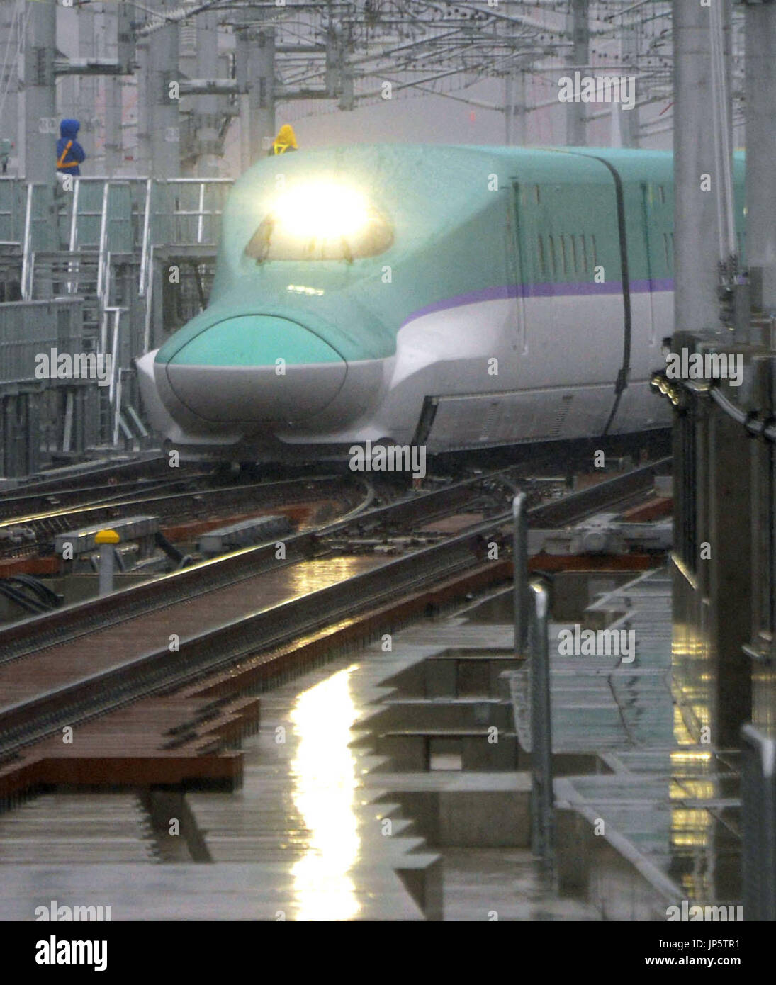 HAKODATE, Japan - An "H5 series" bullet train runs in Nanae in Japan's ...