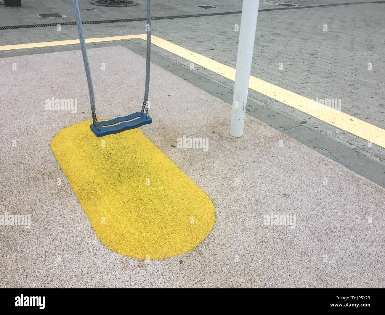 Empty chain swings in children playground Stock Photo - Alamy