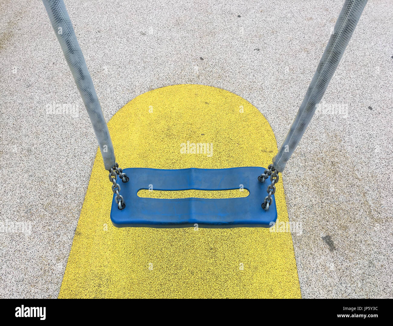 Empty chain swings in children playground Stock Photo - Alamy