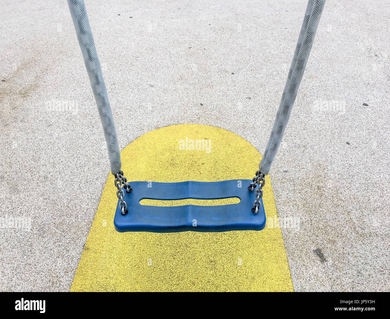 Empty chain swings in children playground Stock Photo - Alamy