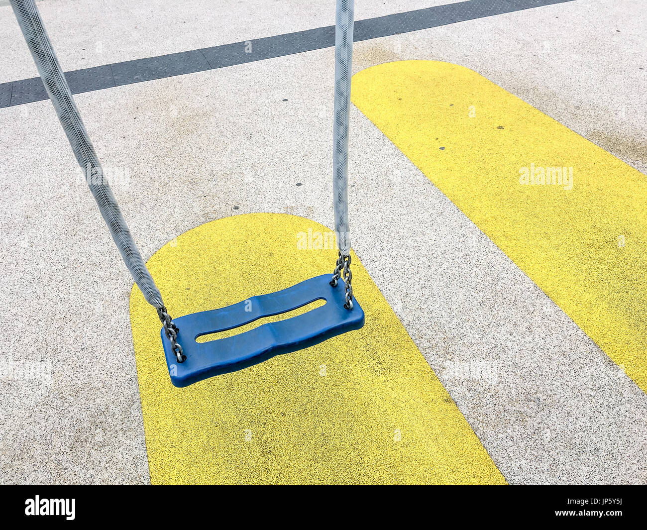 Empty chain swings in children playground Stock Photo - Alamy