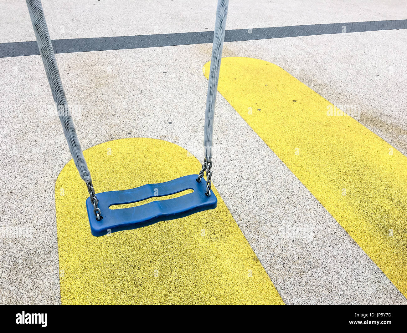 Empty chain swings in children playground Stock Photo - Alamy
