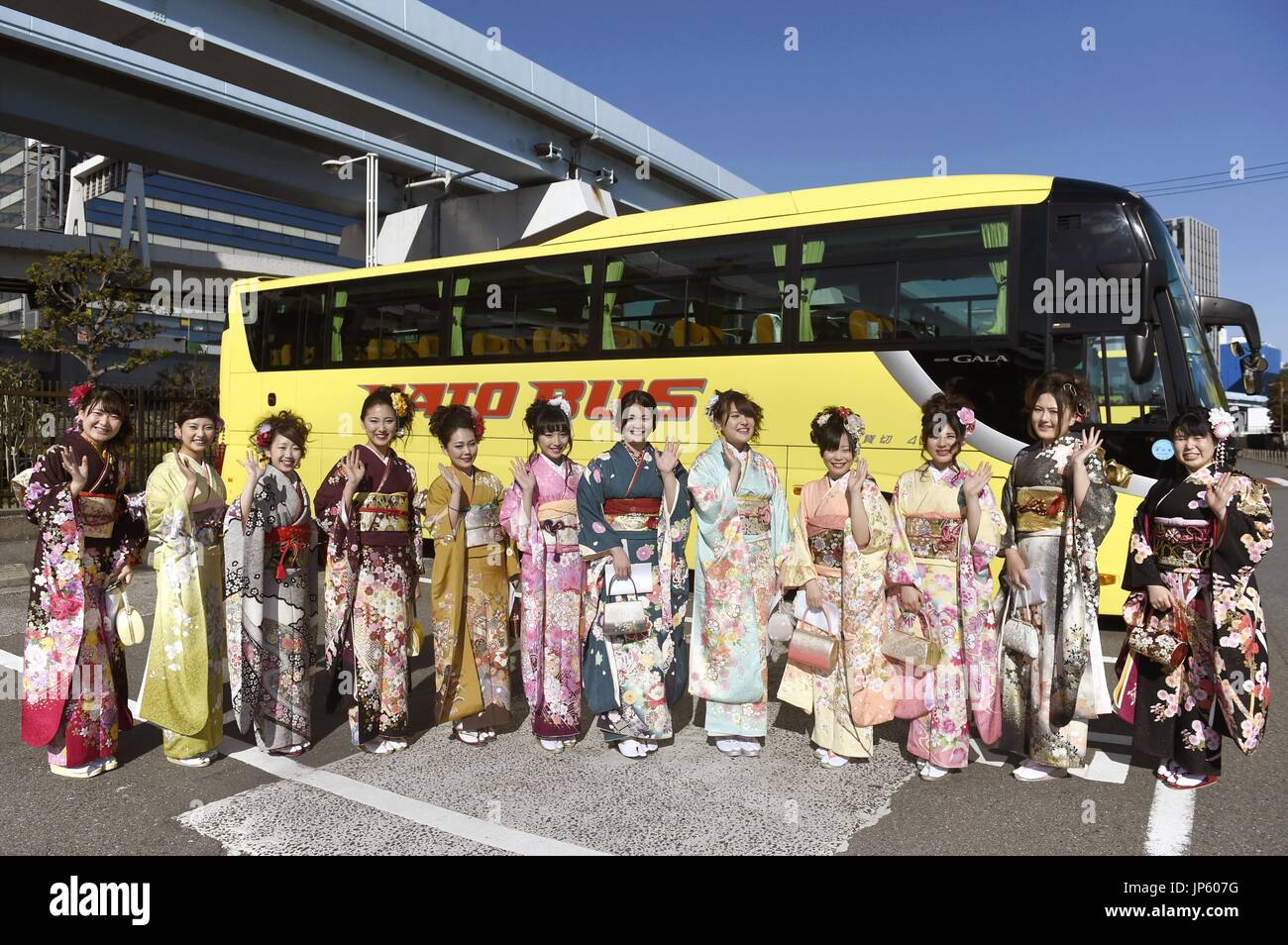 TOKYO, Japan - Tour guides of Hato Bus Co. pose in long-sleeved kimono ...
