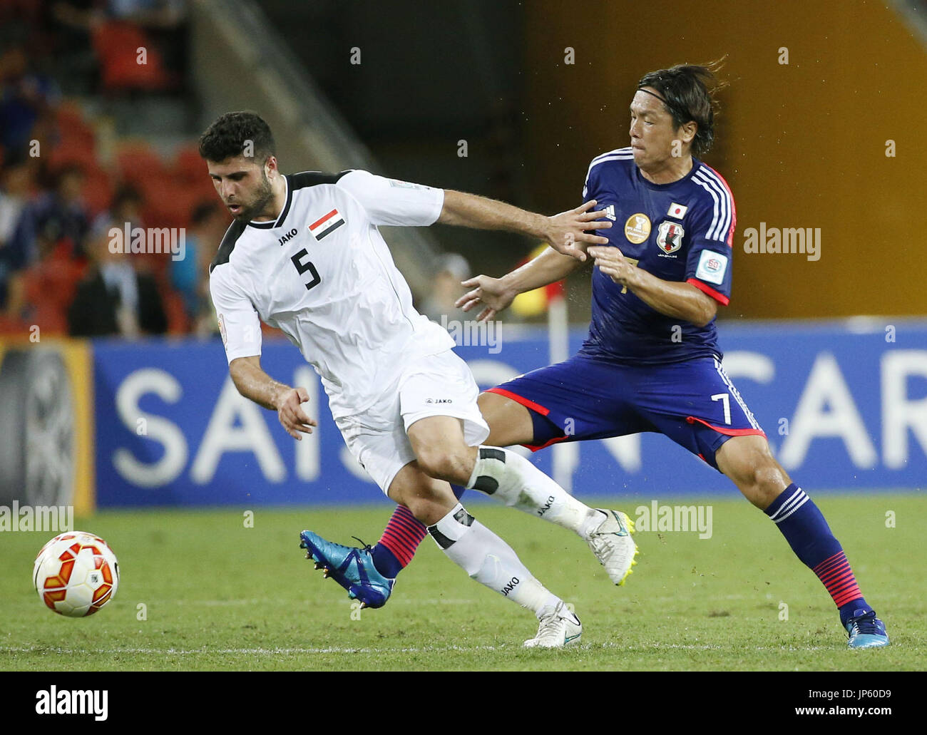BRISBANE, Australia - Iraq's Yaser Safa Kasim (5) and Japan's Yasuhito ...