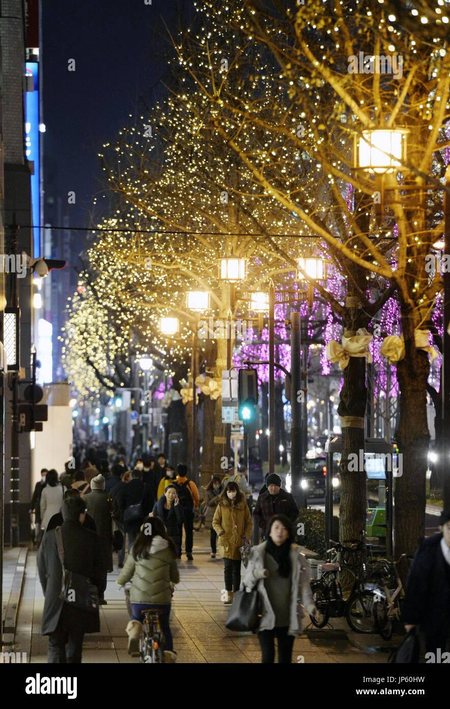 OSAKA, Japan - Pedestrians walk beneath glittering illumination along ...