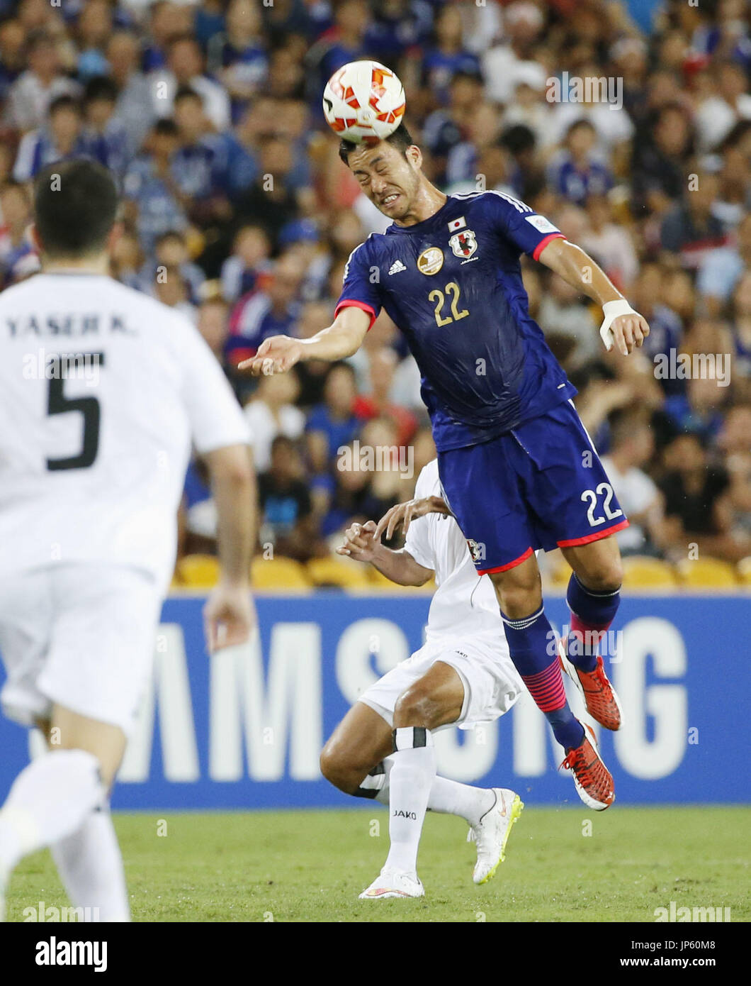 BRISBANE, Australia - Defender Maya Yoshida of Japan clears the ball ...
