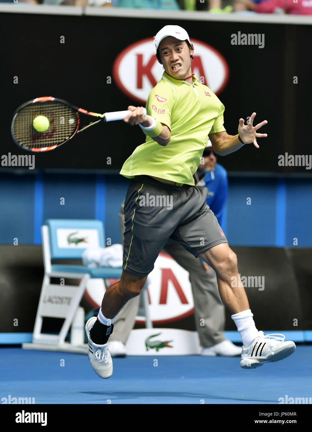 MELBOURNE, Australia - Kei Nishikori of Japan returns a shot during a ...