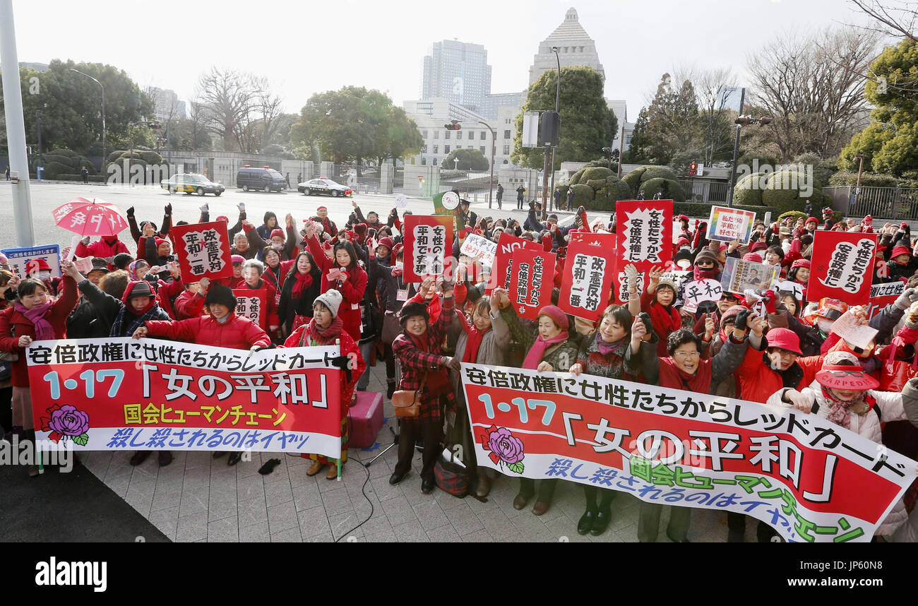 TOKYO, Japan - Thousands of women dressed in red form a human chain ...