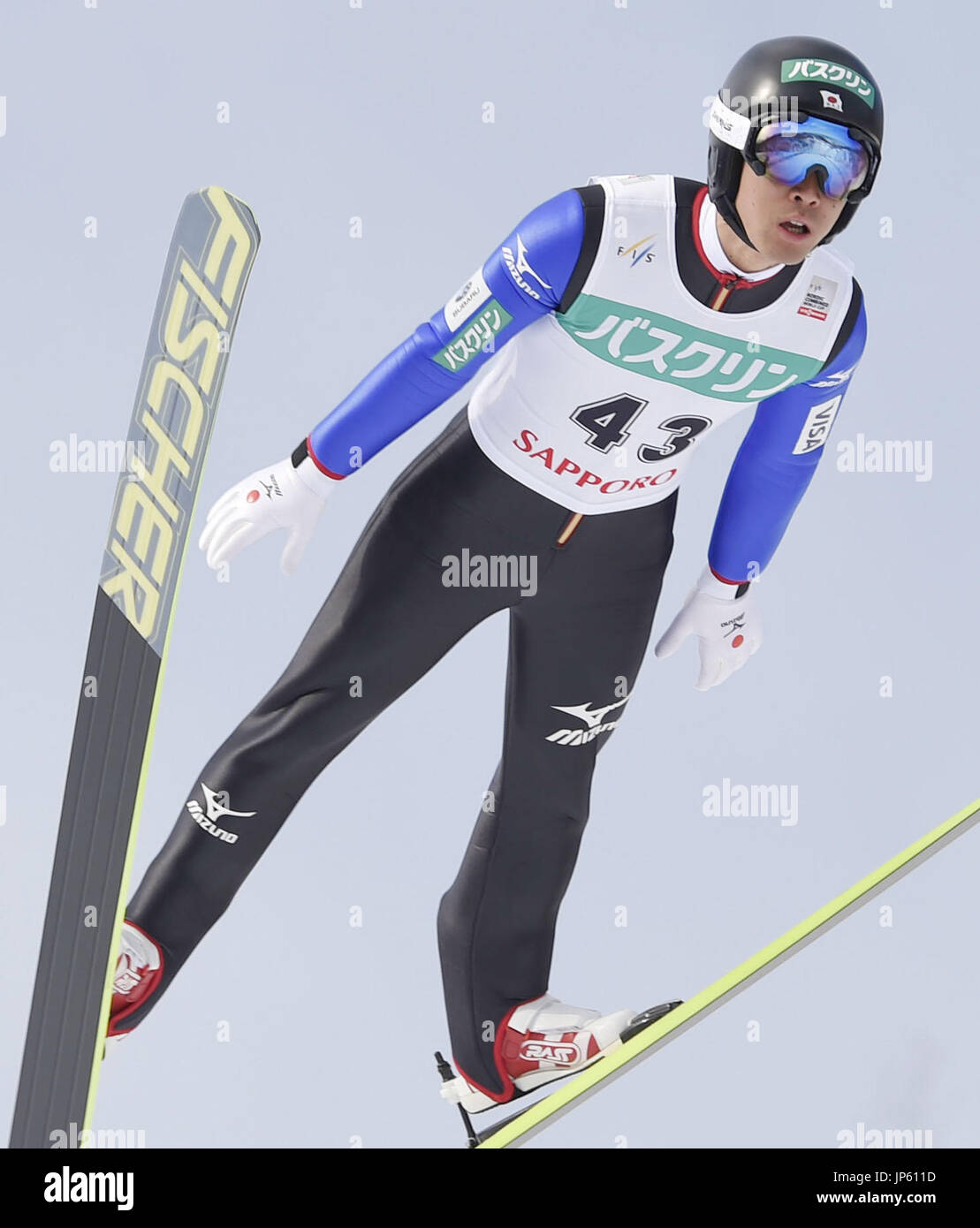 Akito Watabe of Japan soars through the air during the Nordic Combined ...