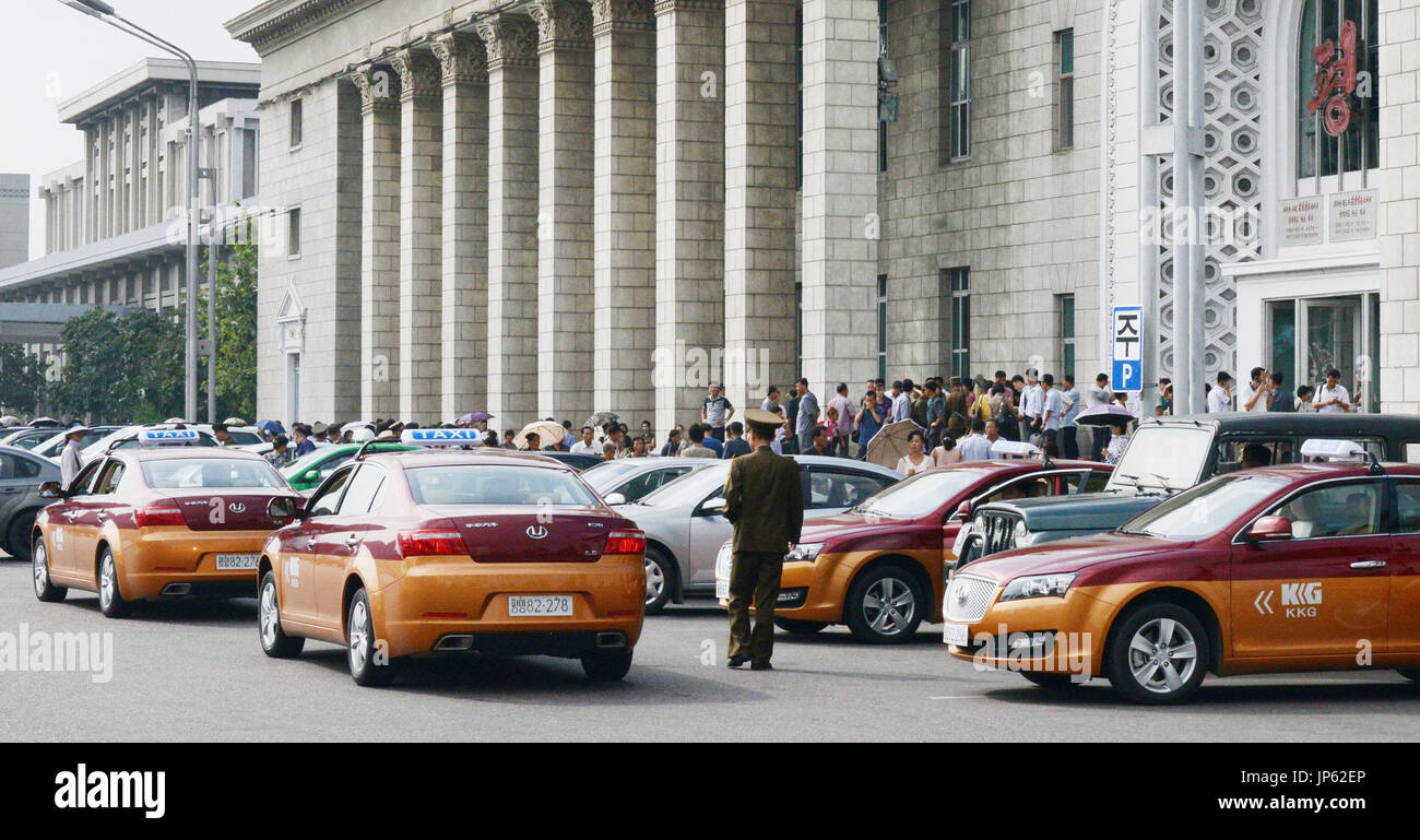 PYONGYANG, North Korea - Taxis wait for passengers in front of ...