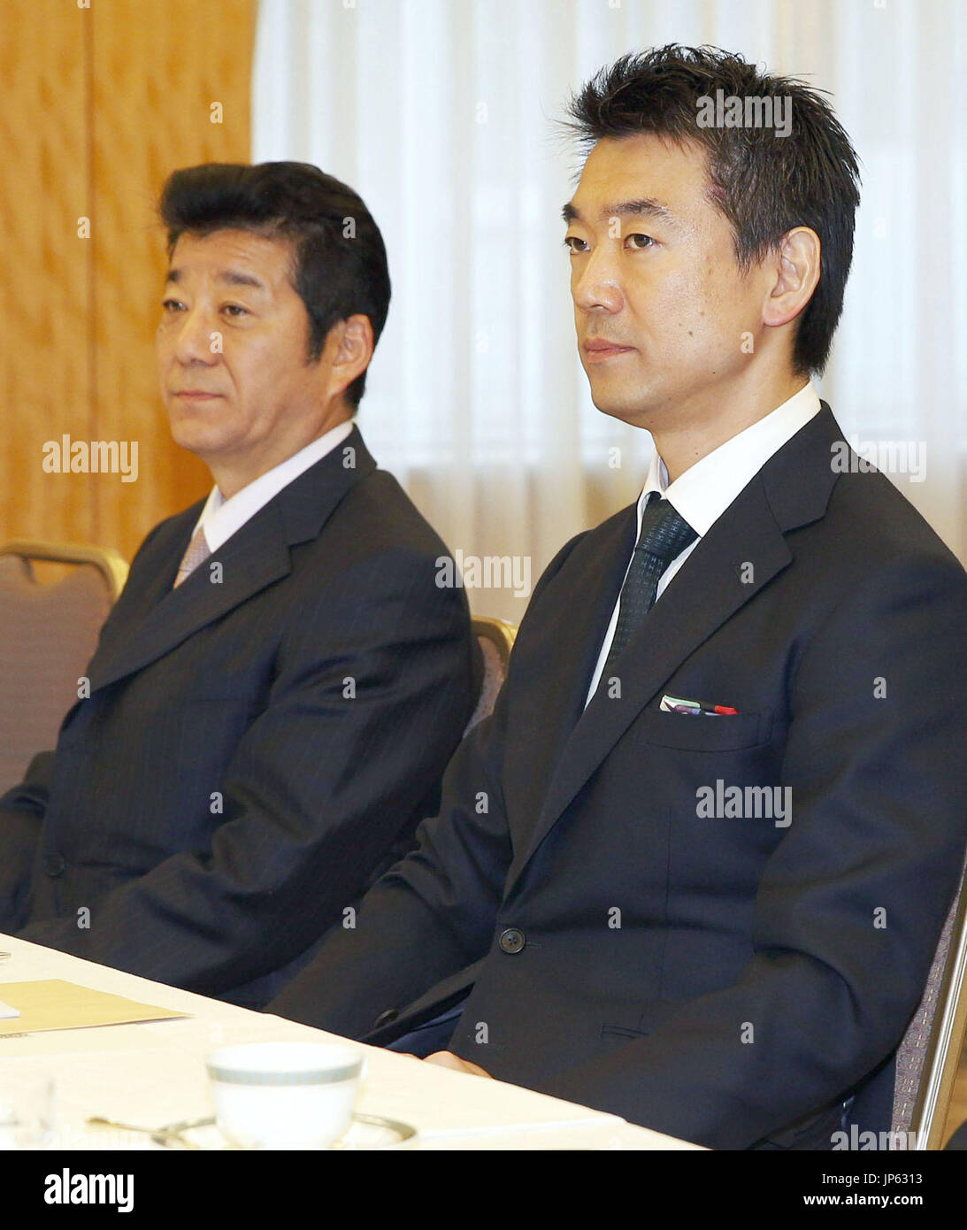 TOKYO, Japan - Osaka Mayor Toru Hashimoto (R) and Osaka Gov. Ichiro ...