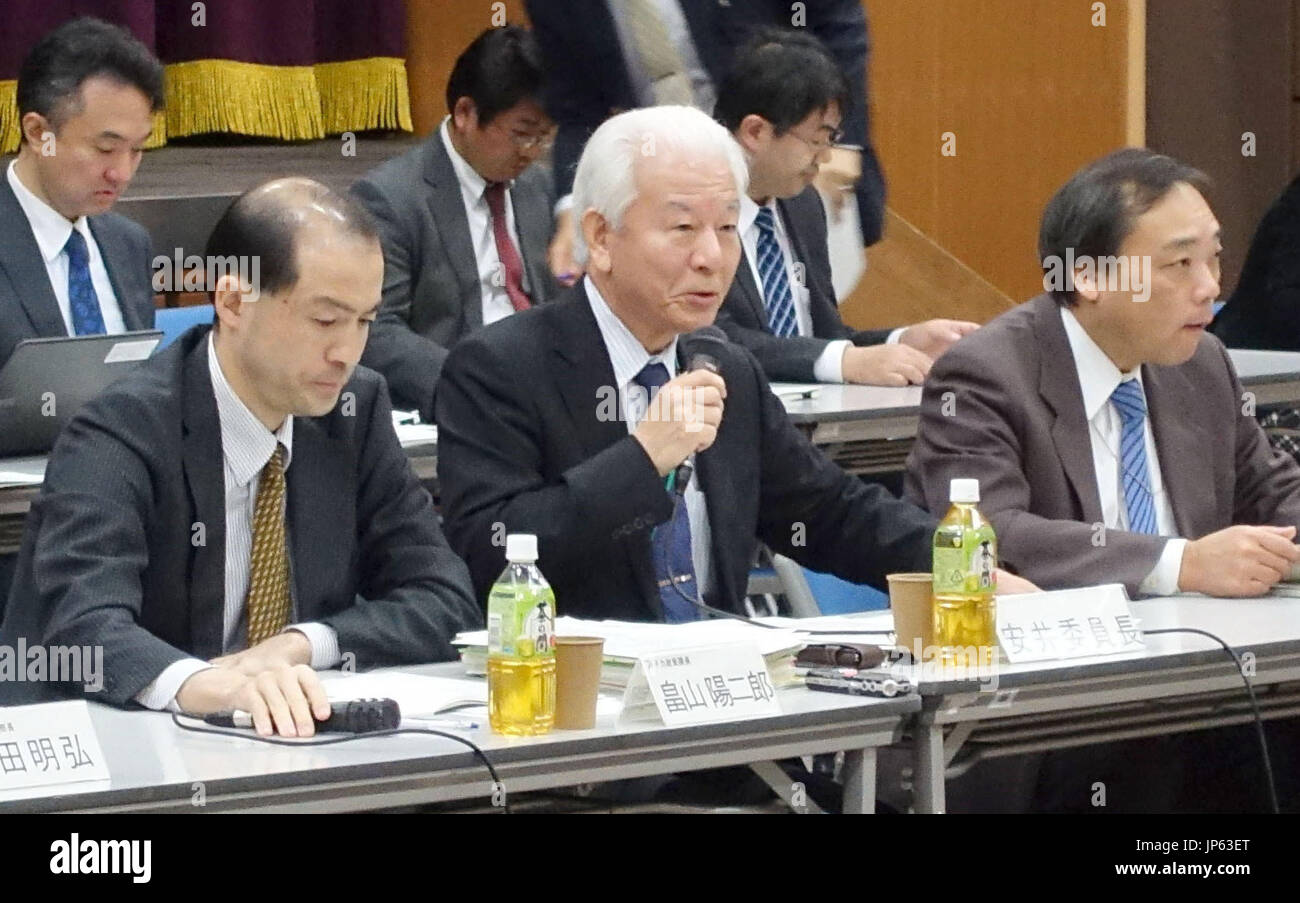 TOKYO, Japan - President Itaru Yasui (C) of the National Institute of ...