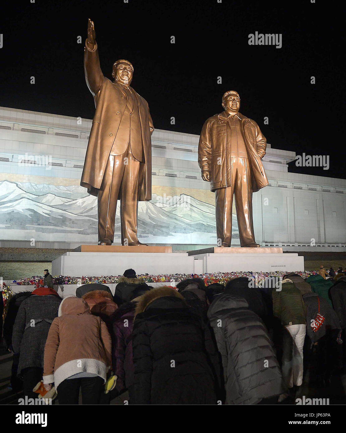 PYONGYANG, North Korea - Citizens of Pyongyang bow in front of bronze ...