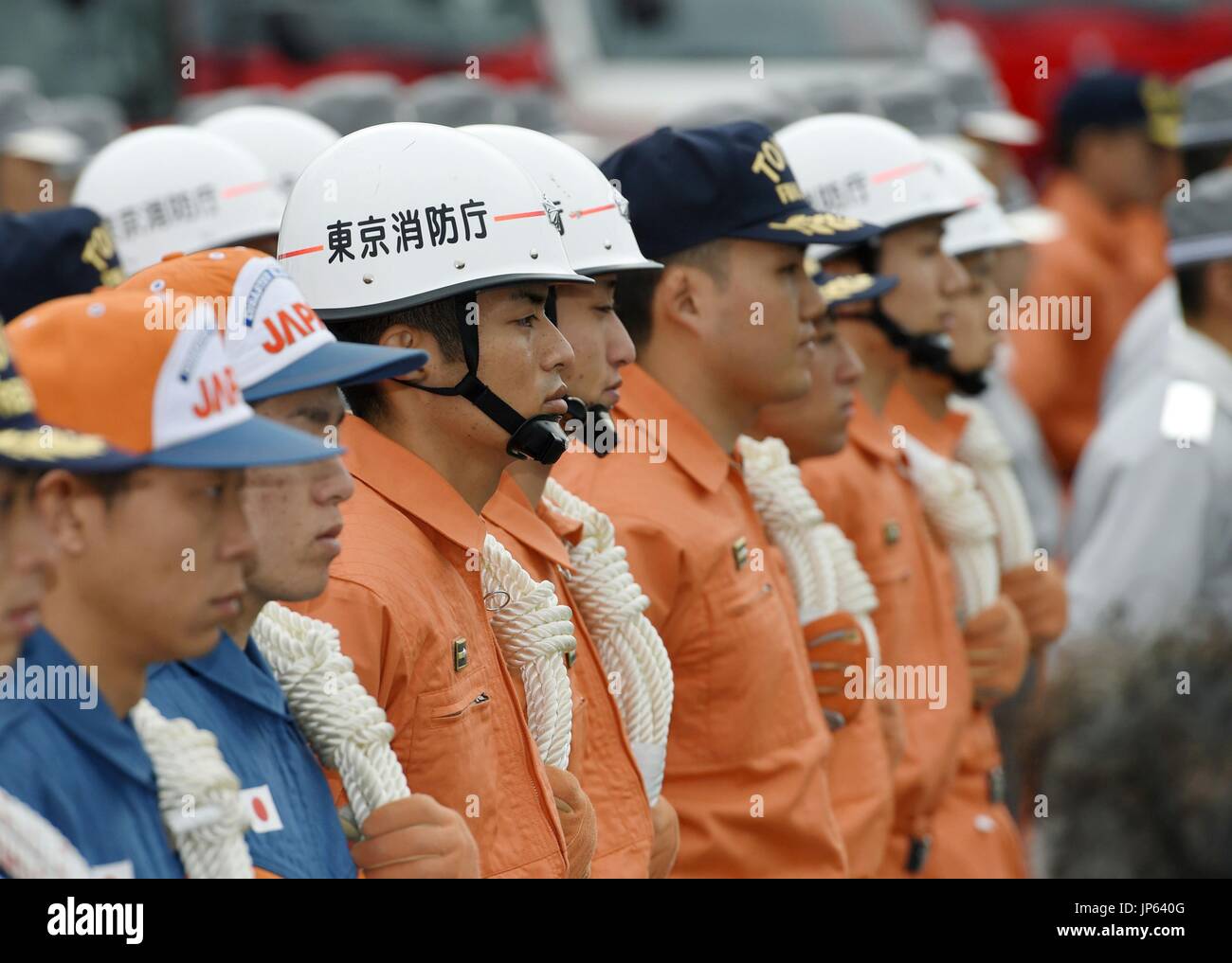 TOKYO, Japan - Firefighters form a line before the annual New Year ...