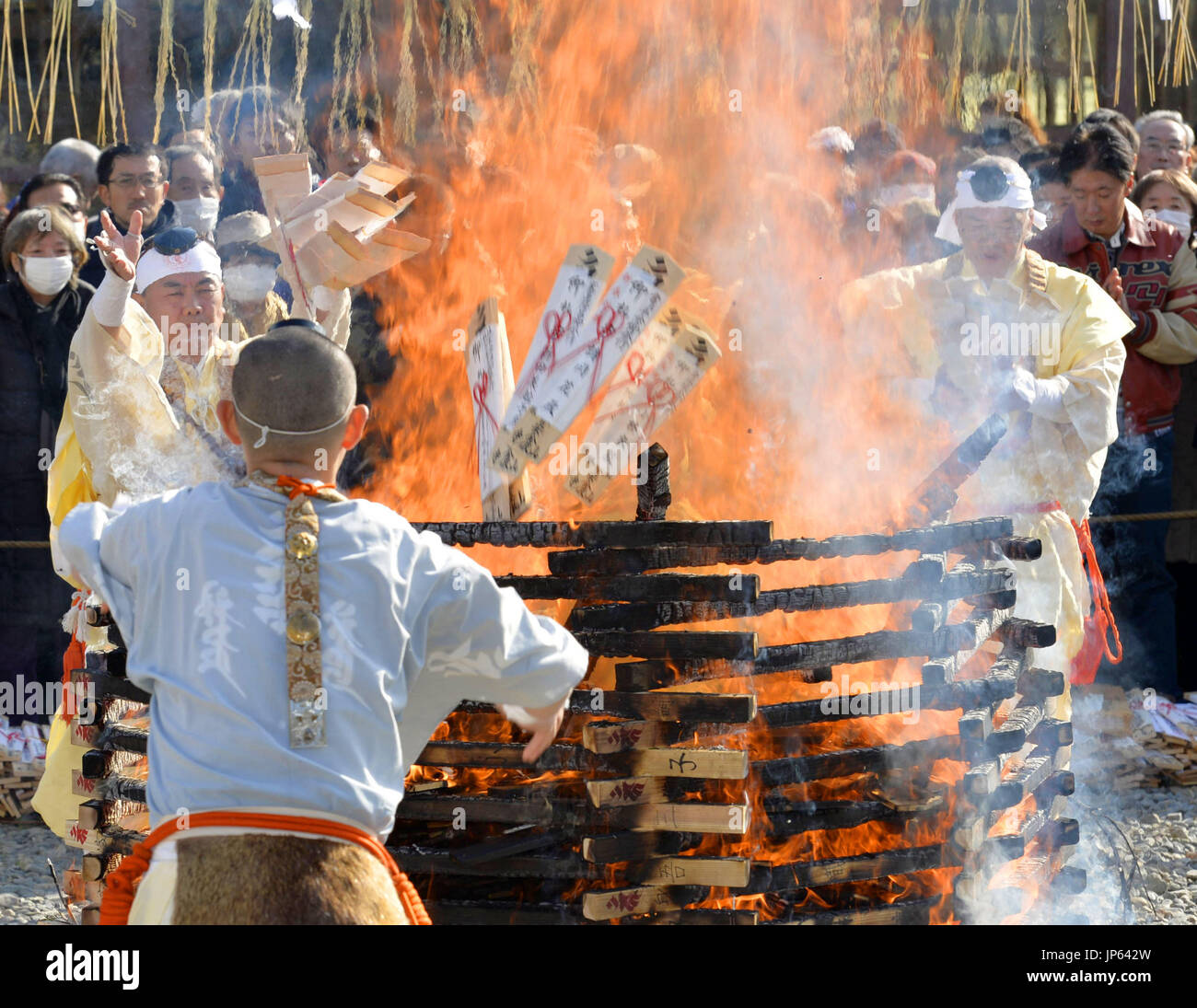 NARITA, Japan - Buddhist priests put old charms on the fire as a token ...
