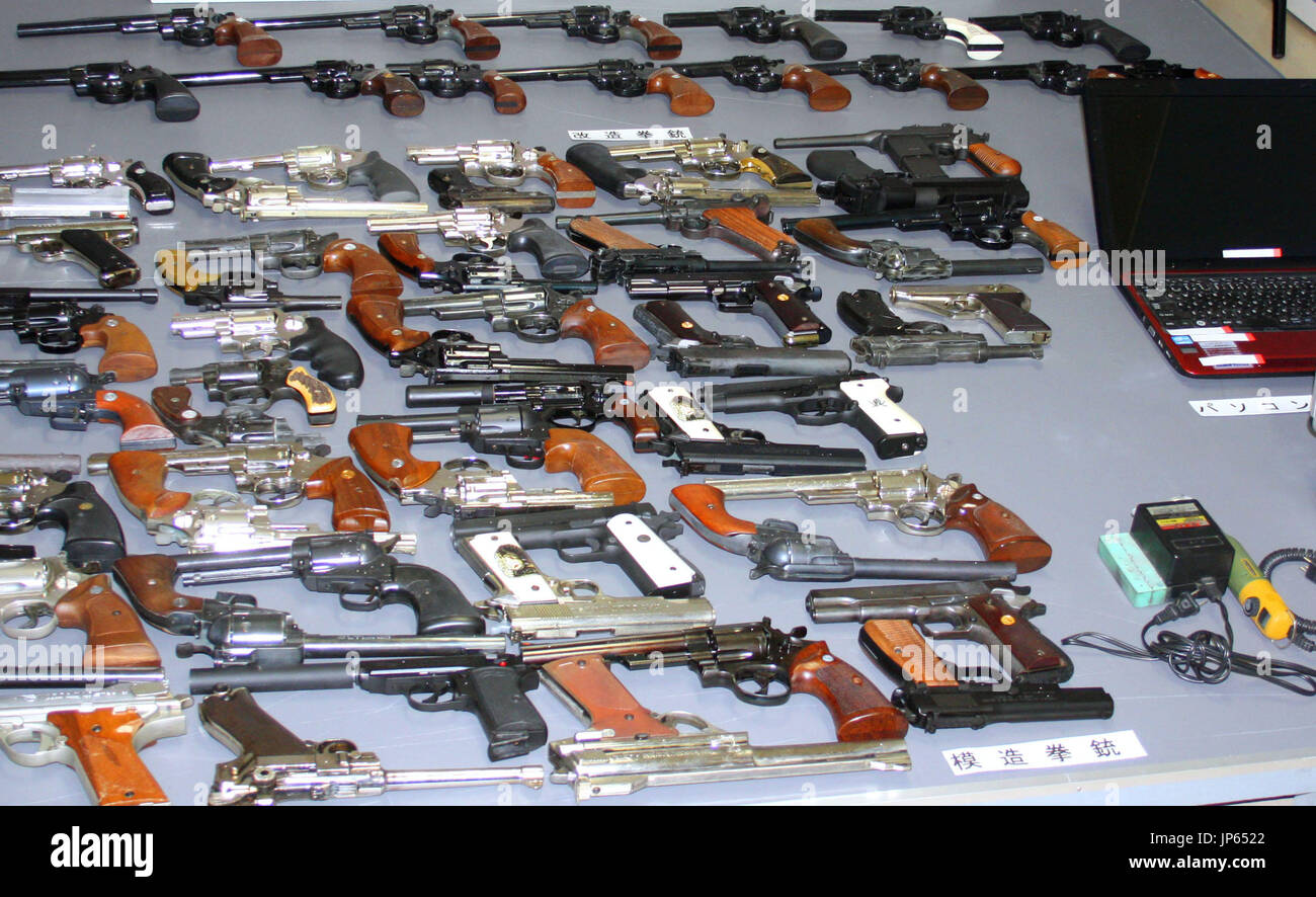 The Tokyo Metropolitan Police Department displays confiscated handguns ...
