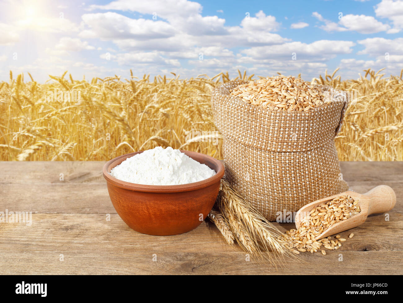 wheat grains and flour on table Stock Photo - Alamy