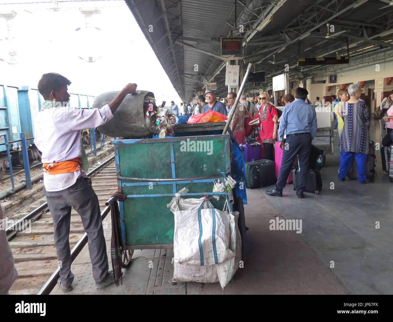 Indian Railroad workers cleaning rail tracks in India, Asia Stock Photo ...