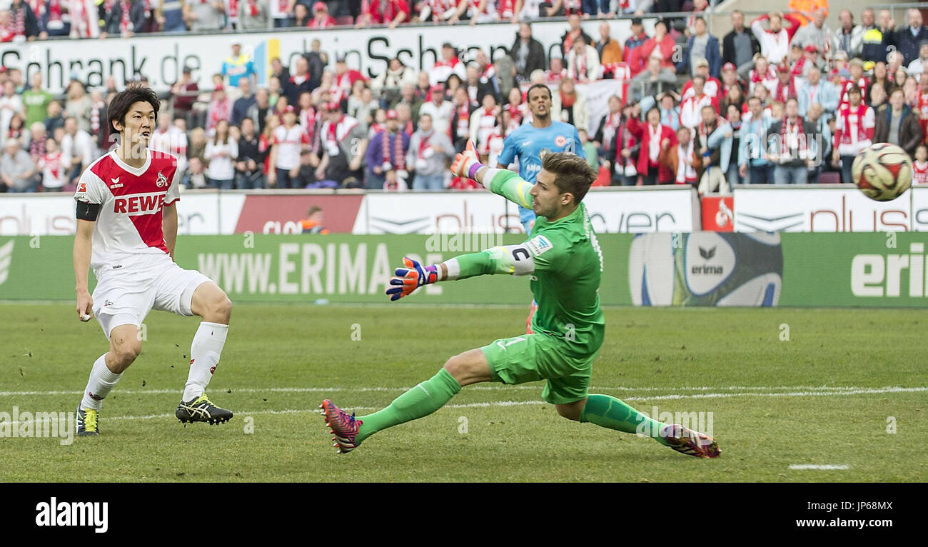 Japan striker Yuya Osako (L) scores past goalkeeper Kevin Trapp during ...