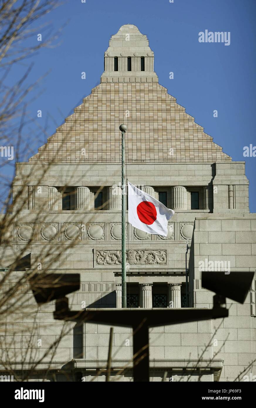 The Japanese flag is hung at half-mast at the Diet building in Tokyo on ...