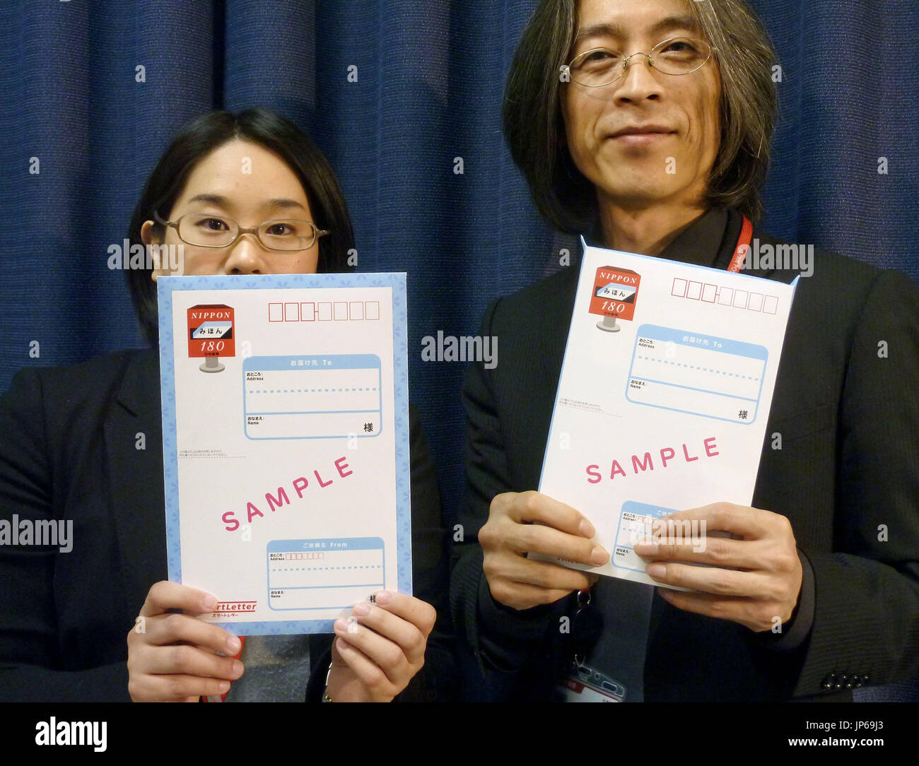 Japan Post Co. workers show "Smart Letter" envelopes in Tokyo on March ...