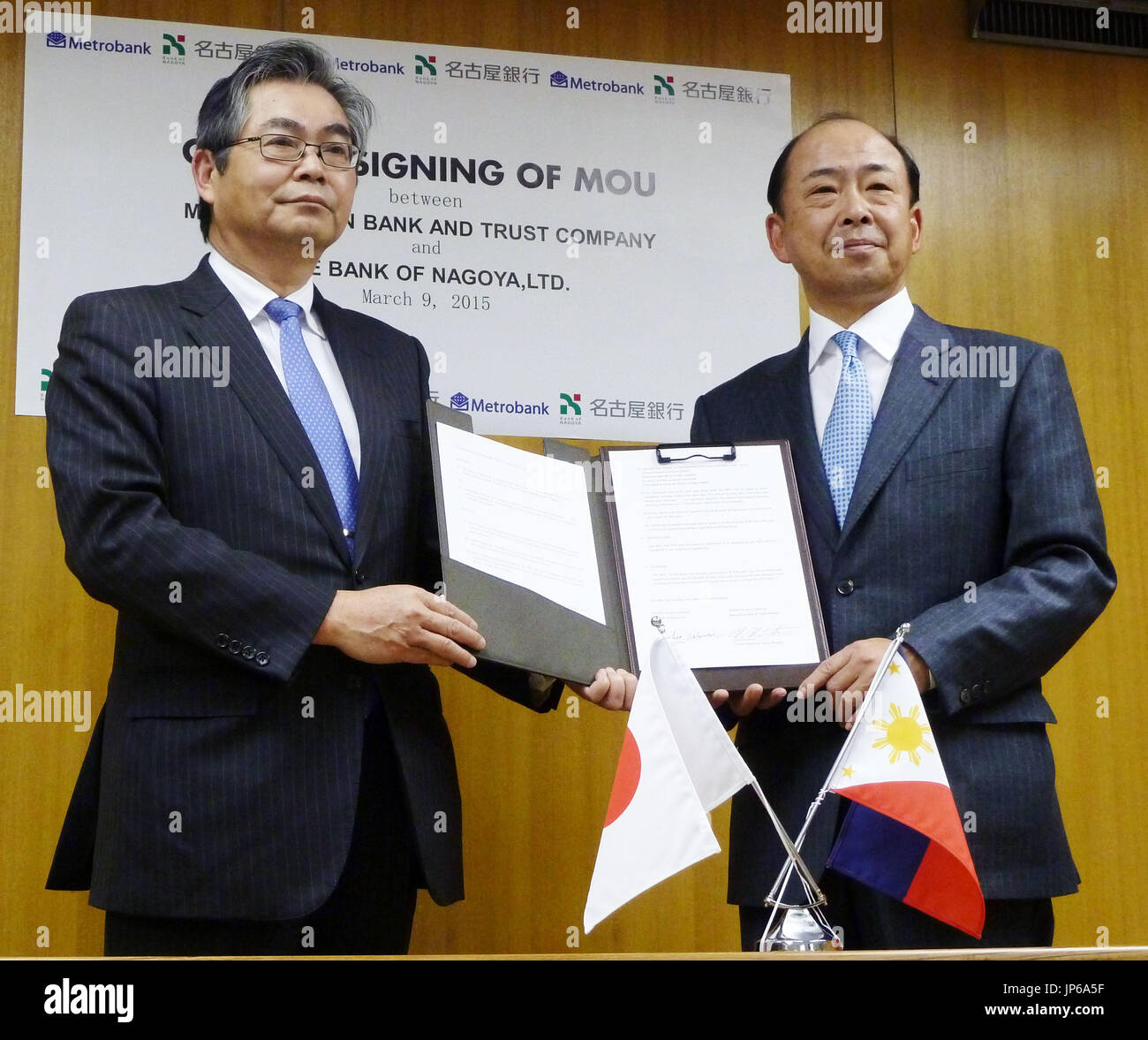 Bank of Nagoya President Masahiro Nakamura (L) and Kenichi Katakura ...