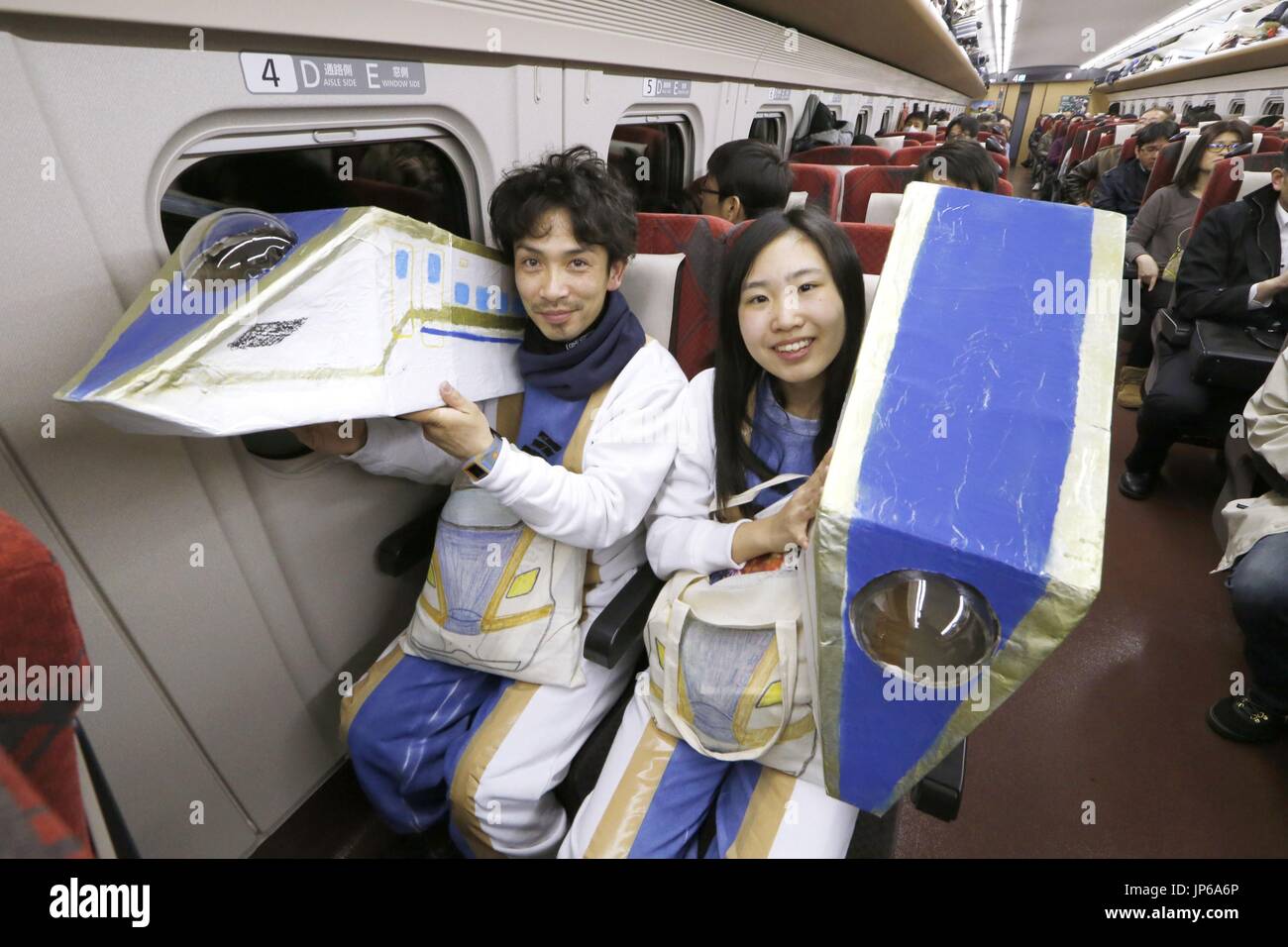 A couple don hand-made costumes of the Hokuriku Shinkansen bullet train ...