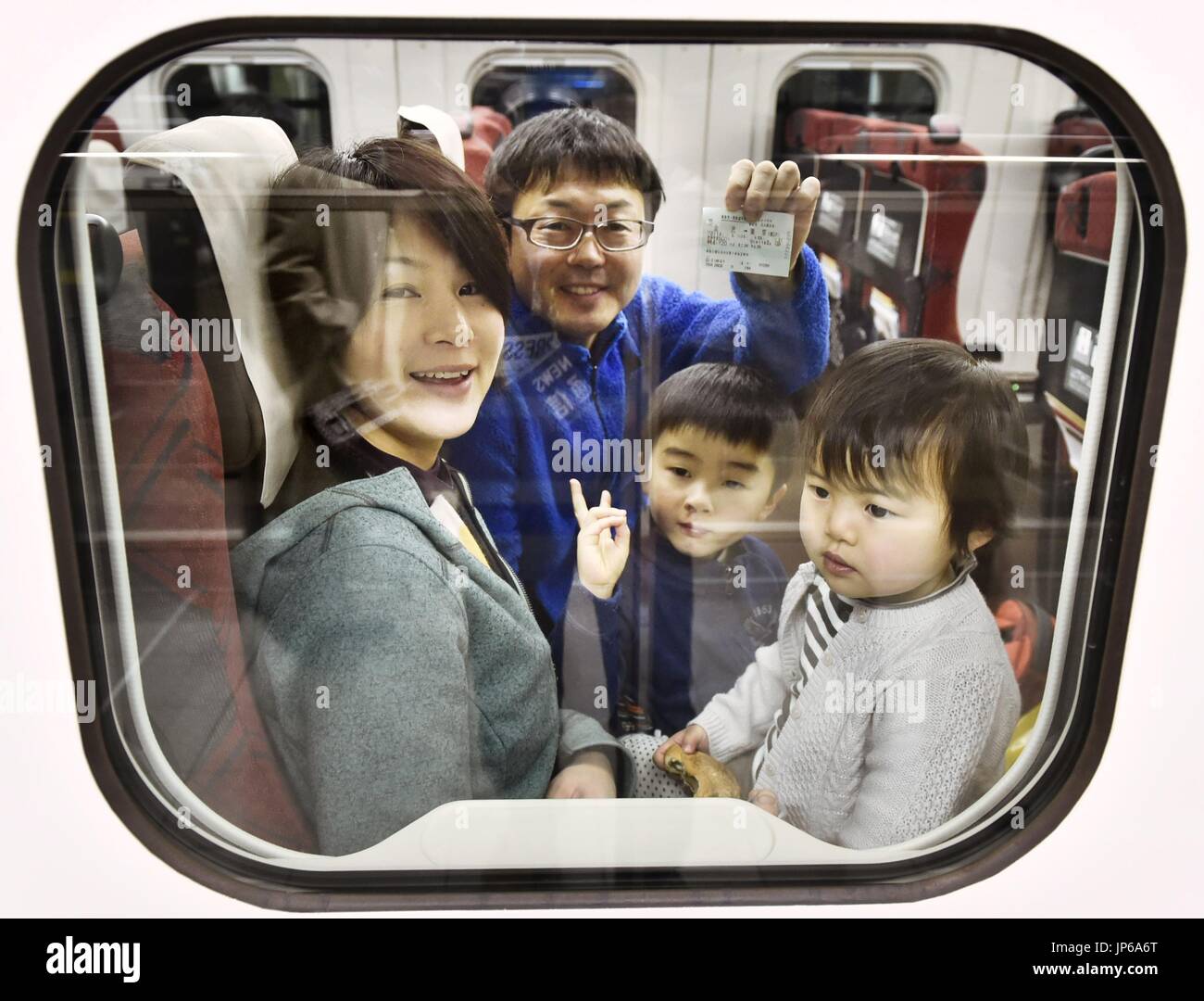 A family smile from inside the first bullet train bound for Tokyo from ...